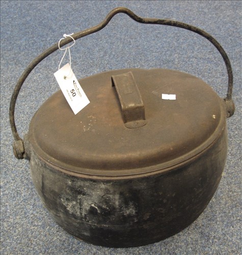 Lot 50 - Cast iron, oval section cooking pot with tin